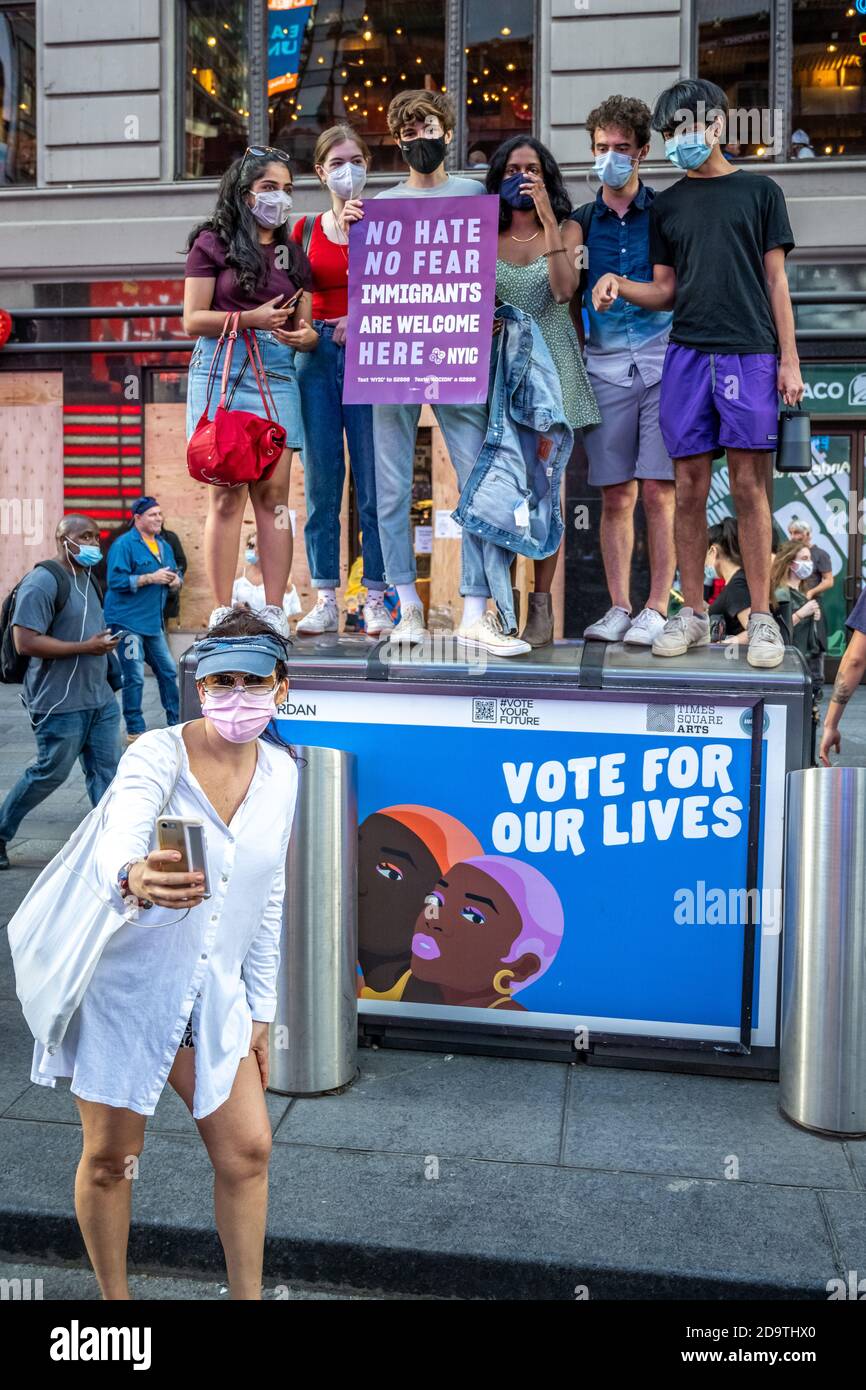 New York, USA. 7th Nov, 2020. People wear face masks as they celebrate ...