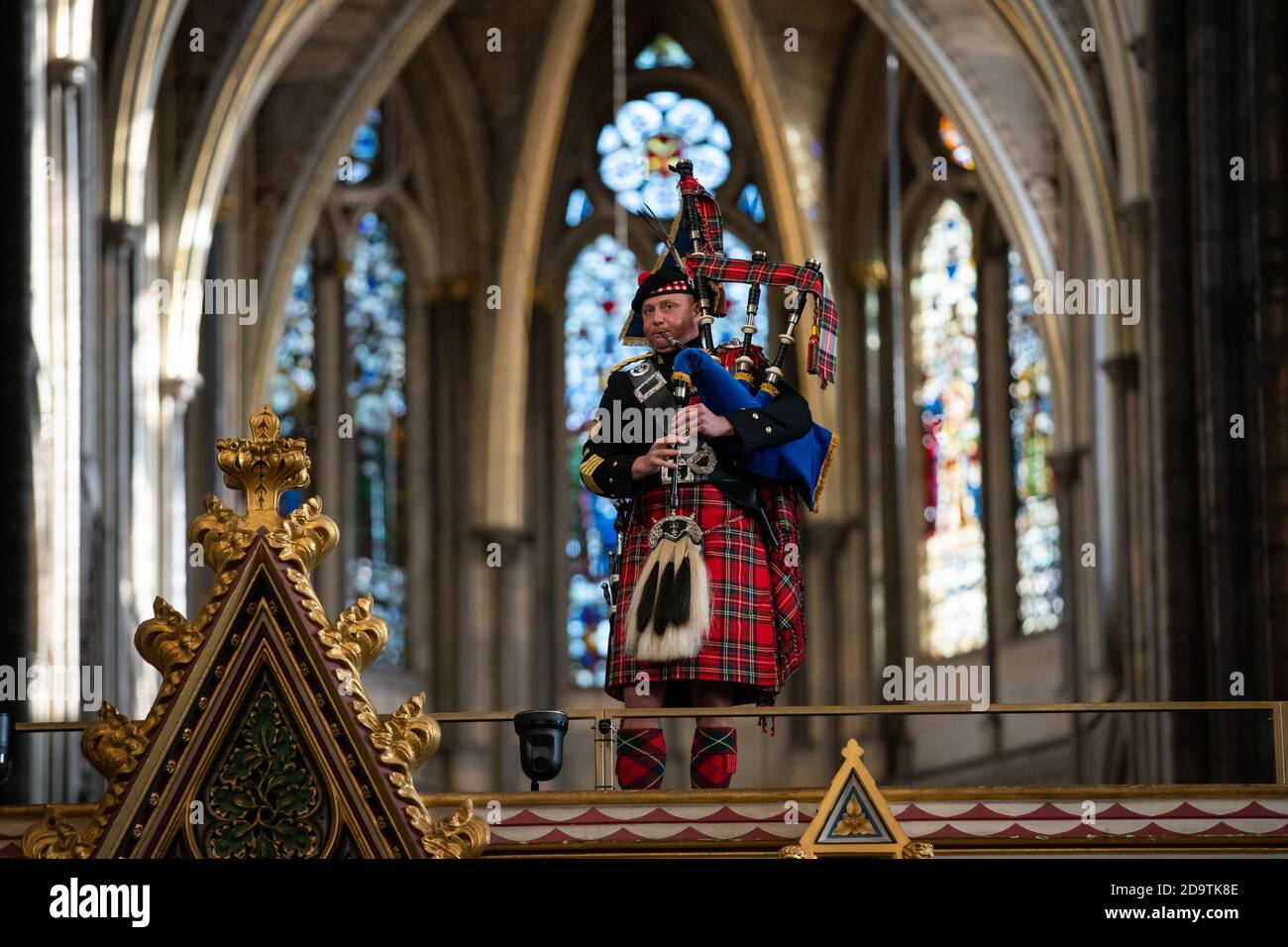 The Queen's Piper plays during a ceremony in London's Westminster Abbey ...