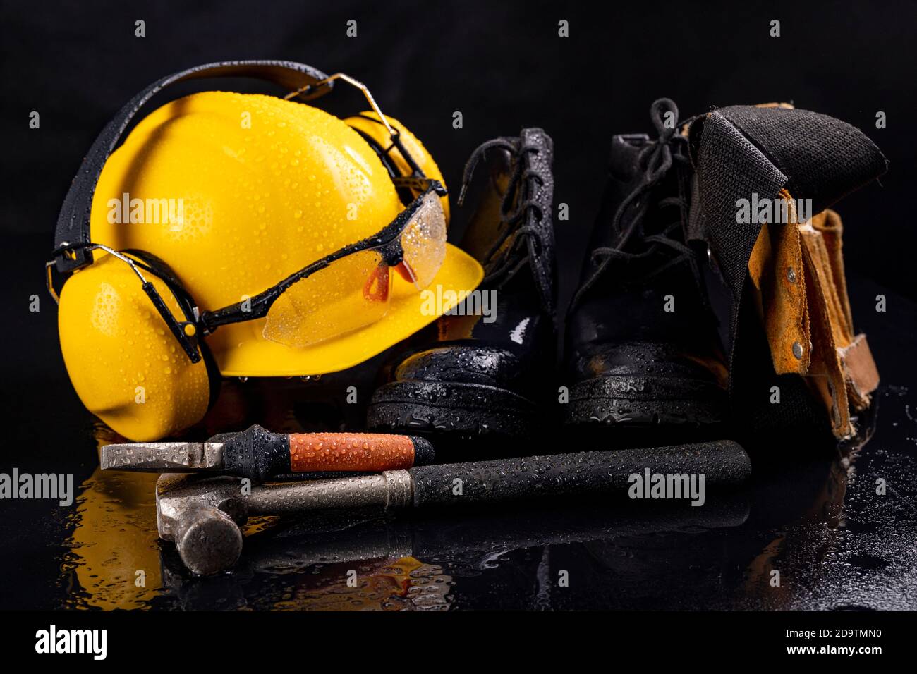 Wet work clothes and tools for the production worker. Raindrops on the ...
