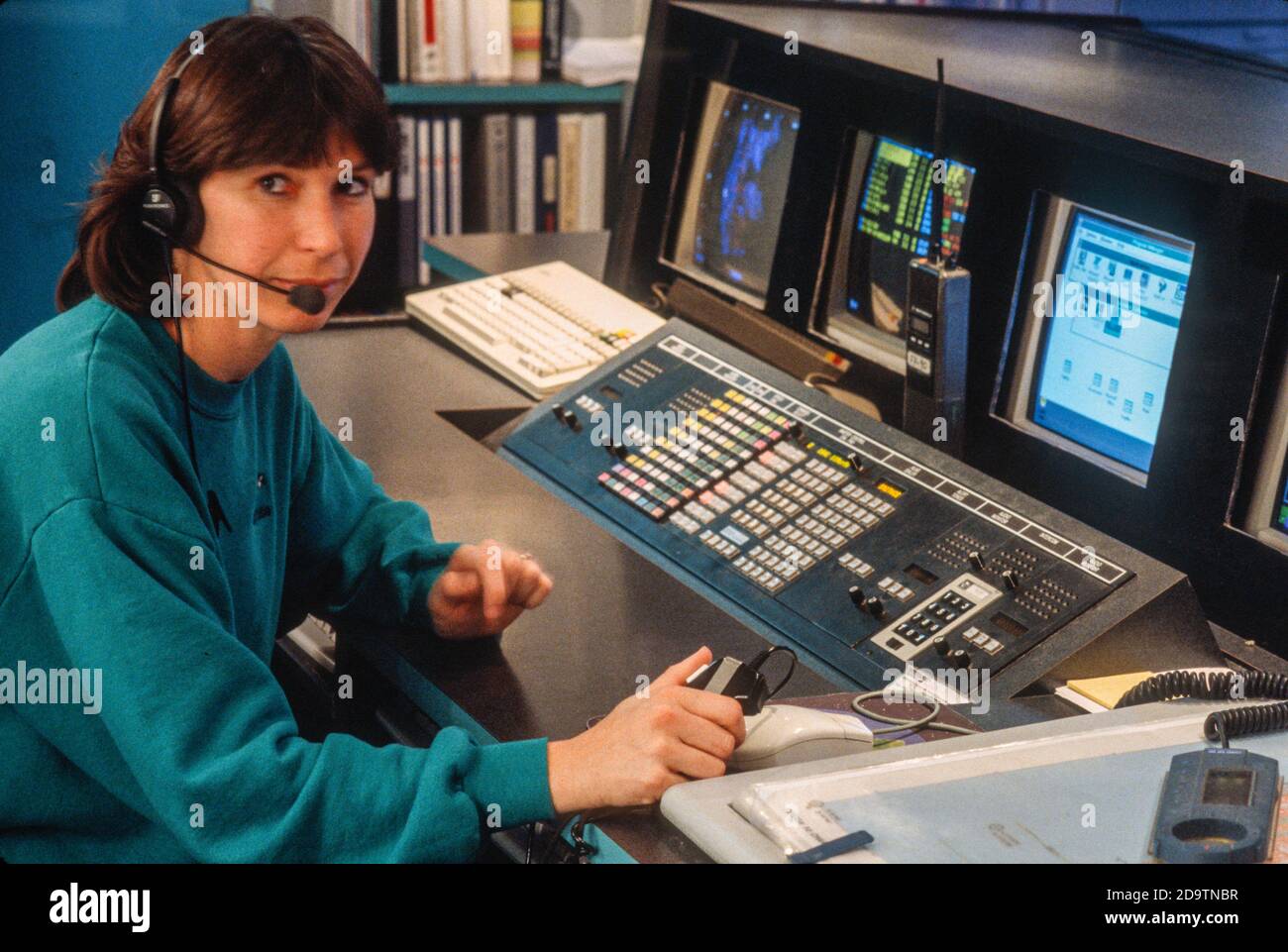 Female dispatcher at helicopter medevac control station in a large ...