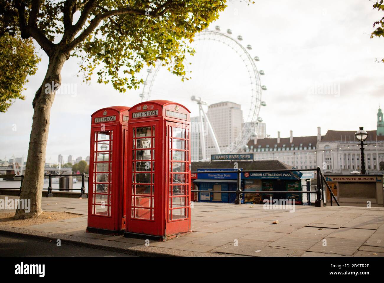 British Telephone Booths Under a Tree and with The London Eye as ...