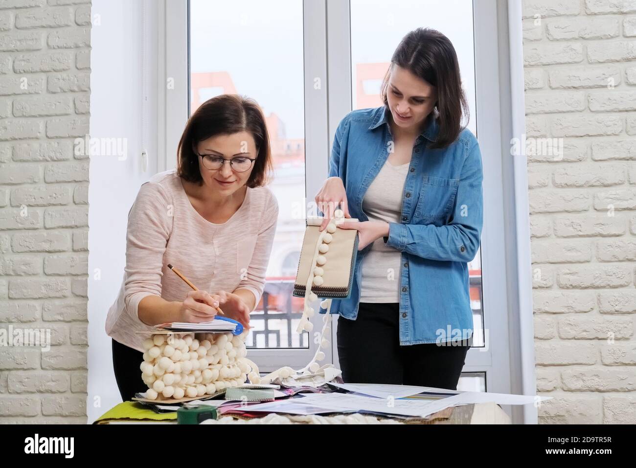 Women designers choosing fabrics hi-res stock photography and images ...