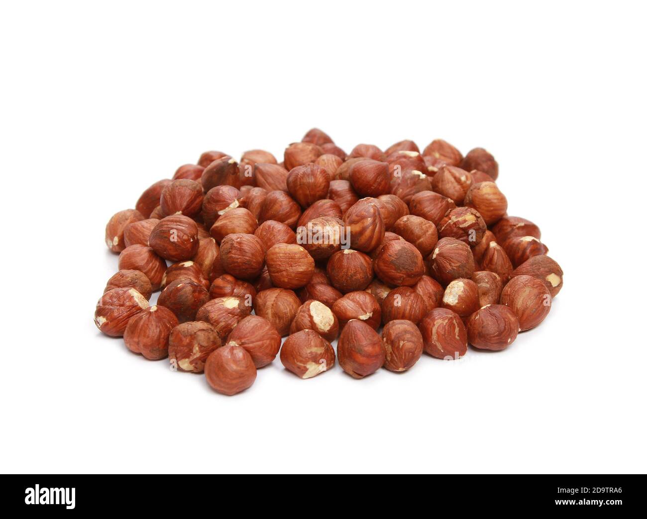 Pile of sweet and delicious hazelnuts on a white surface Stock Photo ...