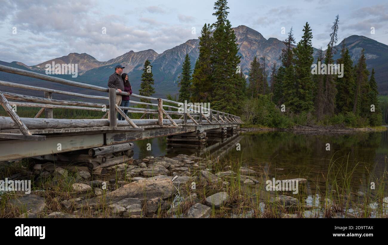 Couple standing on bridge hi-res stock photography and images - Alamy