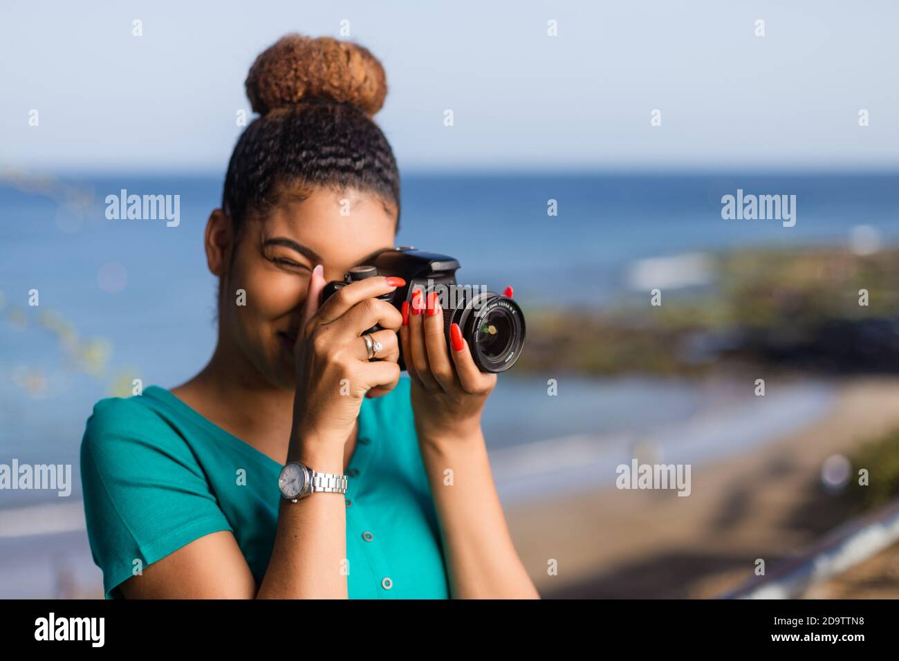 African American woman photographer taking outdoor photos - Black ...