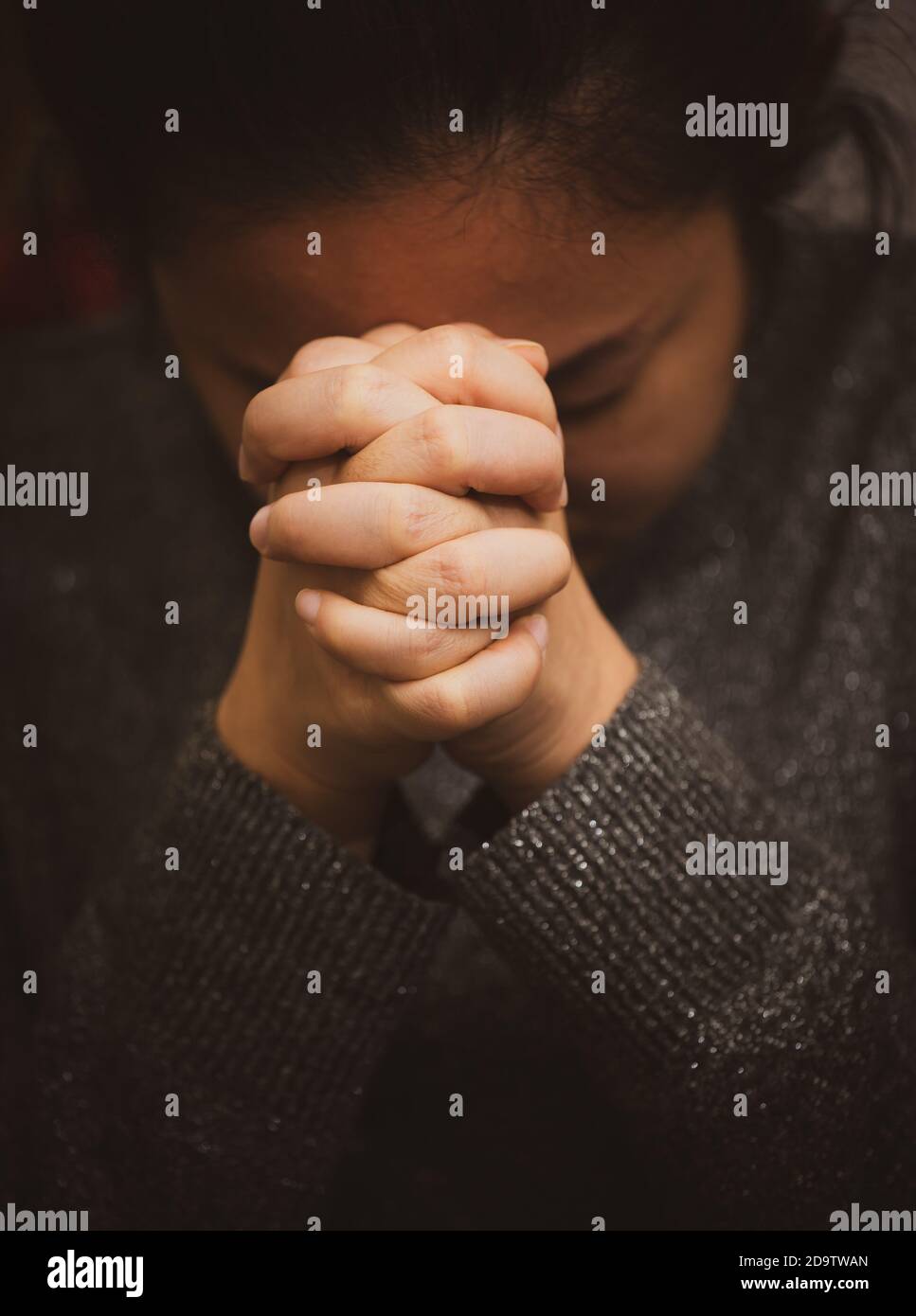 An Asian woman is praying to God for what she wants to heal, sadness ...