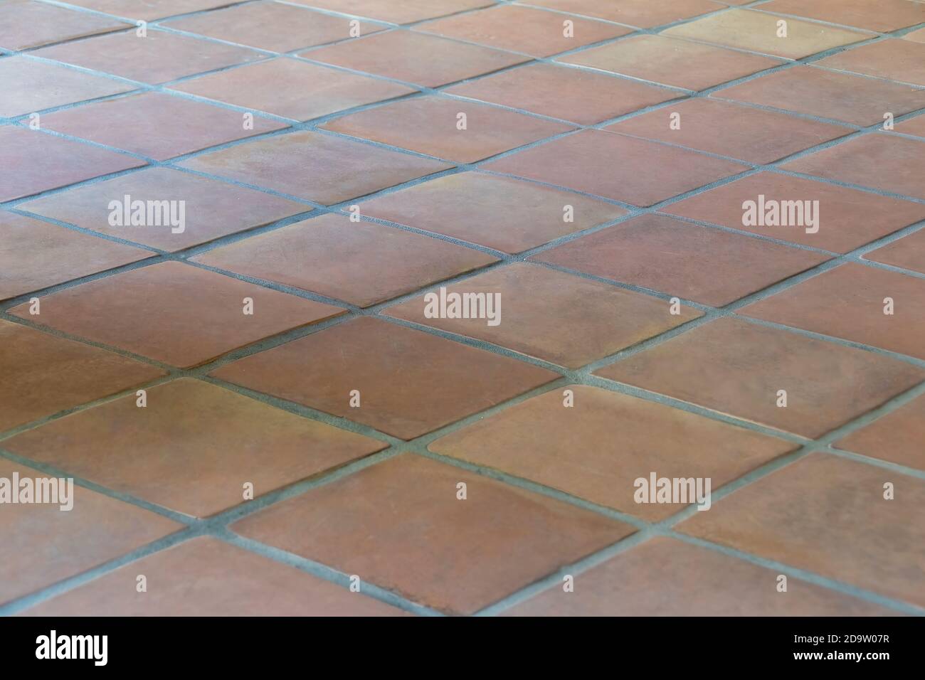 Terra cotta tile walkway background Stock Photo - Alamy