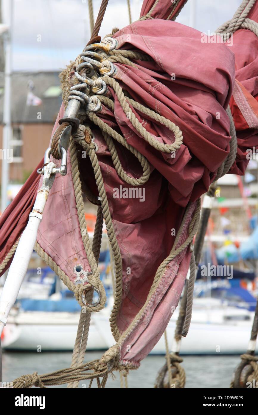 The red furled sail of Reaper, an old Fifie or sailing fishing drifter ...