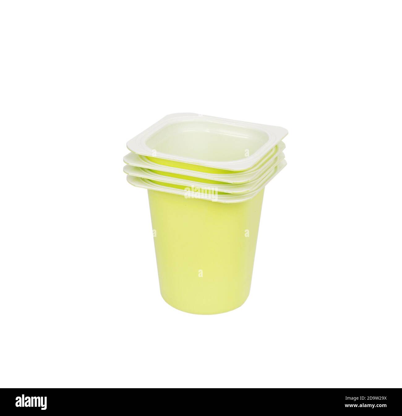 Yellow plastic containers for yogurt isolated on a white background ...