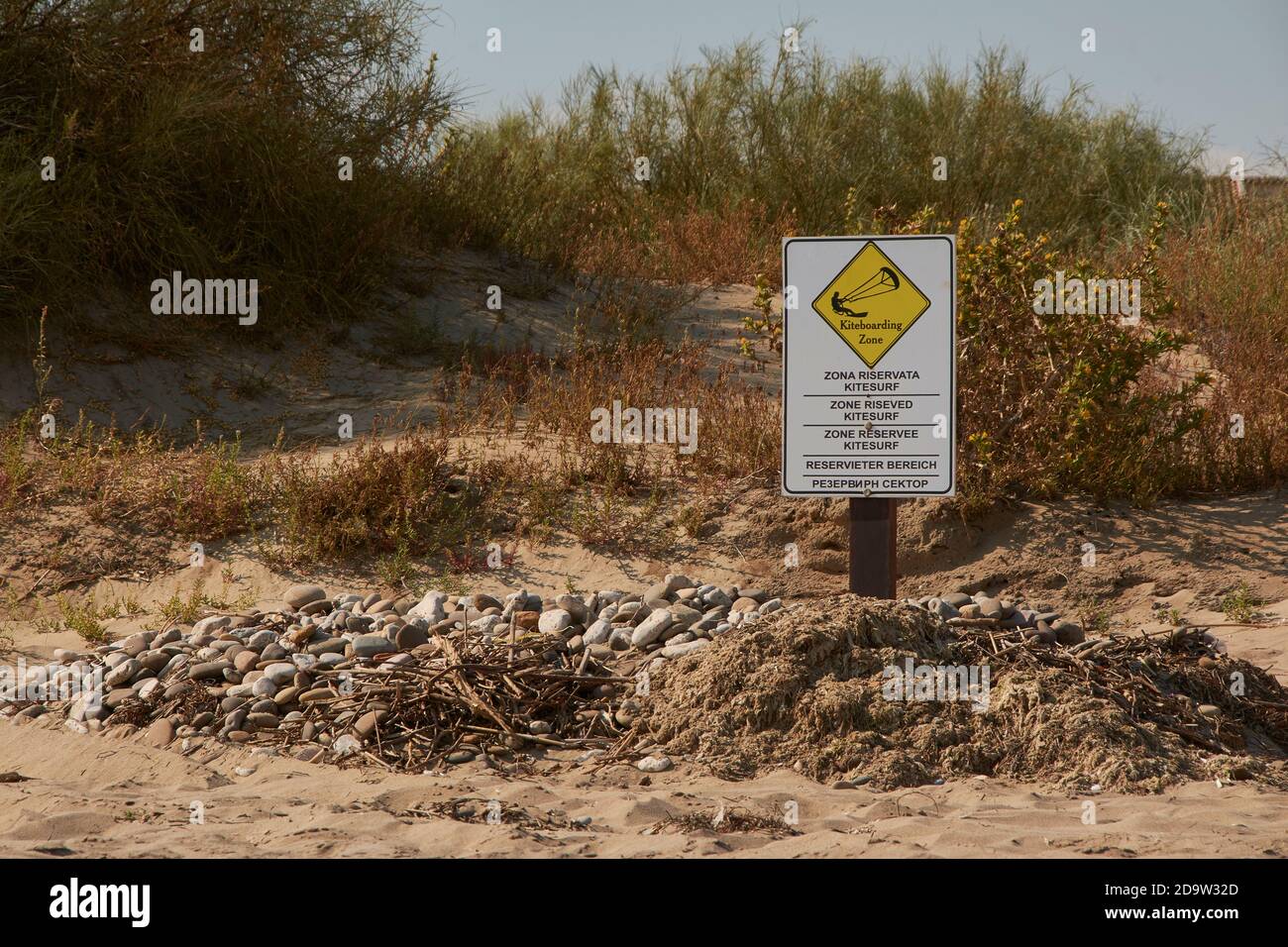Informative sign on the beach with the words "Kiteboarding zone Stock ...