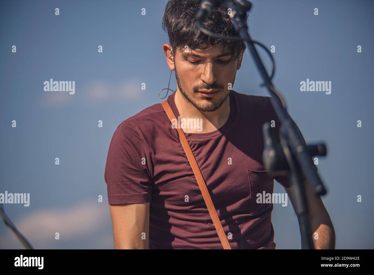 Extreme close up of a singer at the microphone during a live concert ...