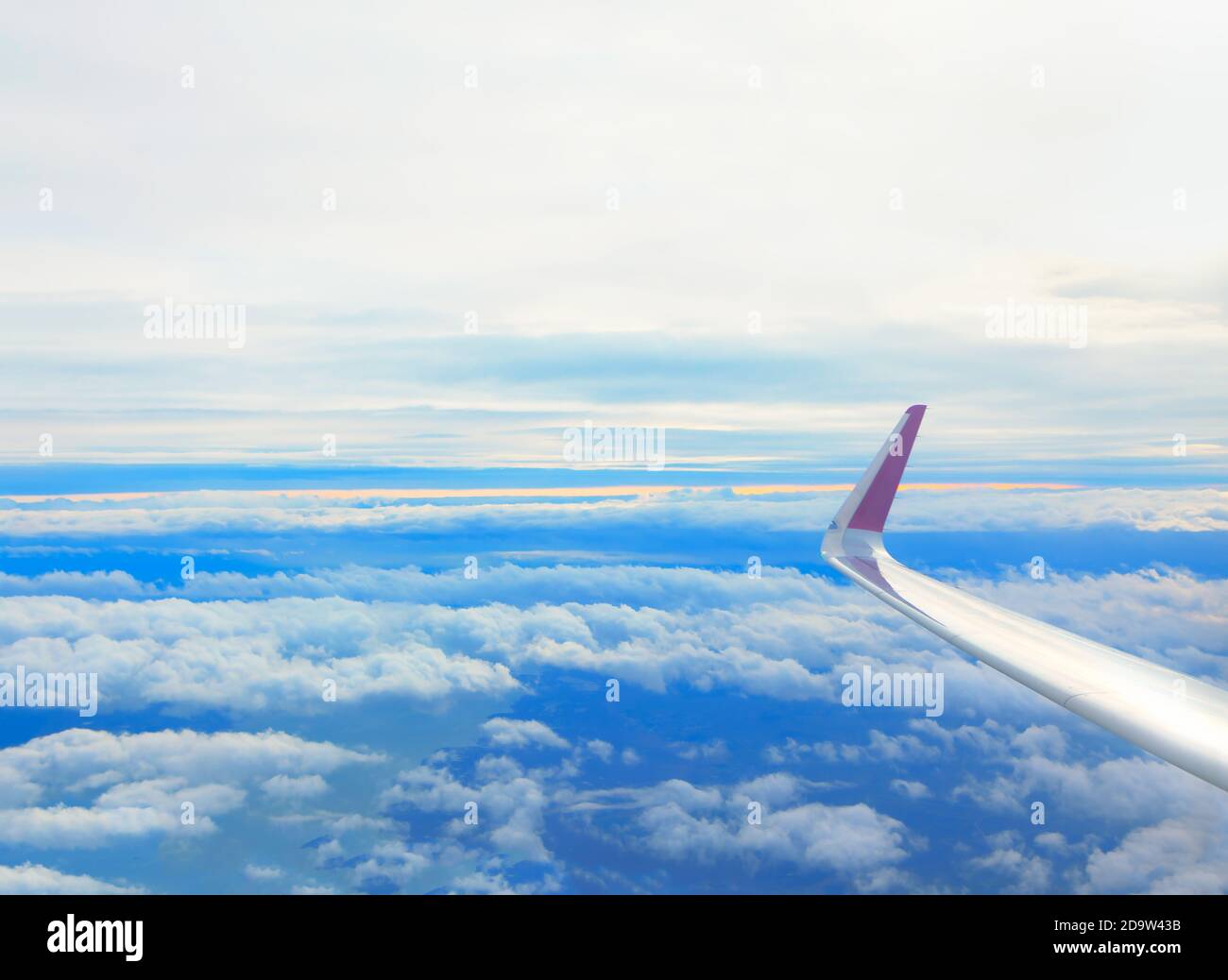 View from airplane window . Aircraft wing over the clouds Stock Photo ...