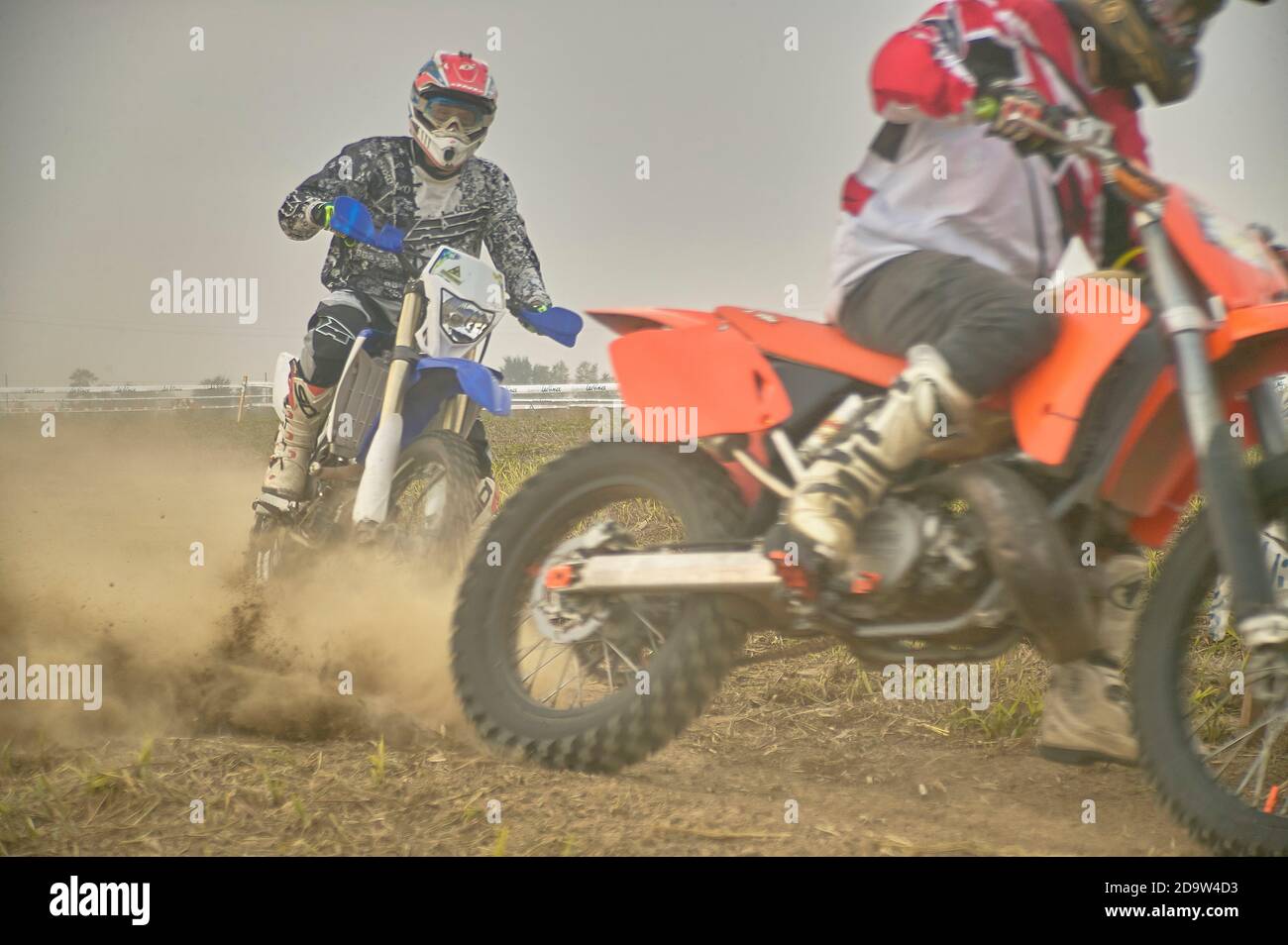 Motocross rider intent on driving his motorbike to the finish line in a ...