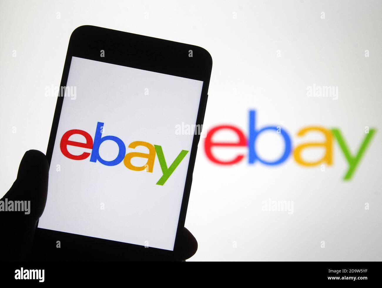 In this photo illustration an eBay logo seen on a smartphone screen ...