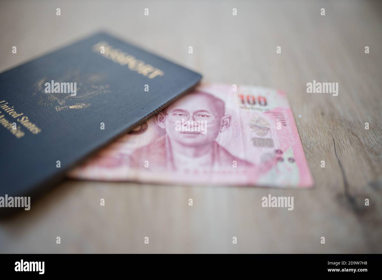 100 Thai Baht Bill Partially Inside a United States of America Passport ...