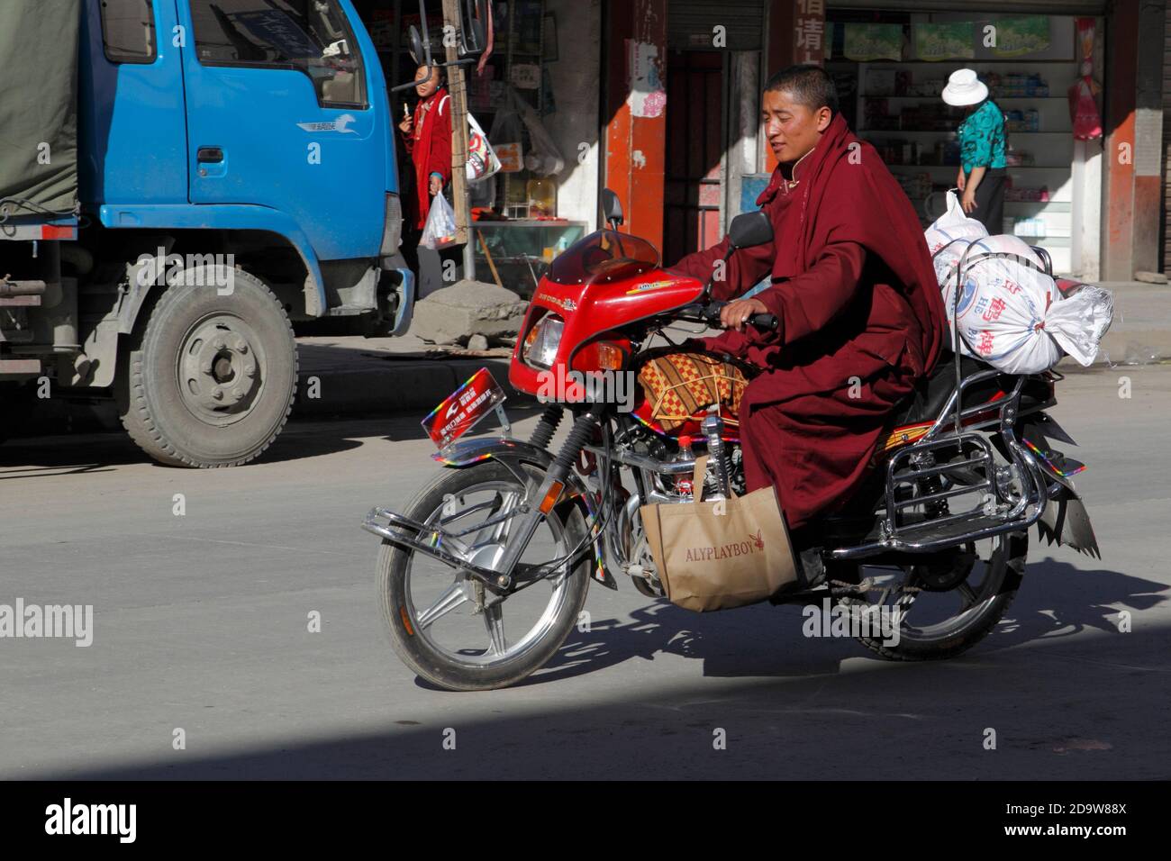 Buddhist Monk on a Chinese motorcycle, Bamei, west Sichuan Province ...