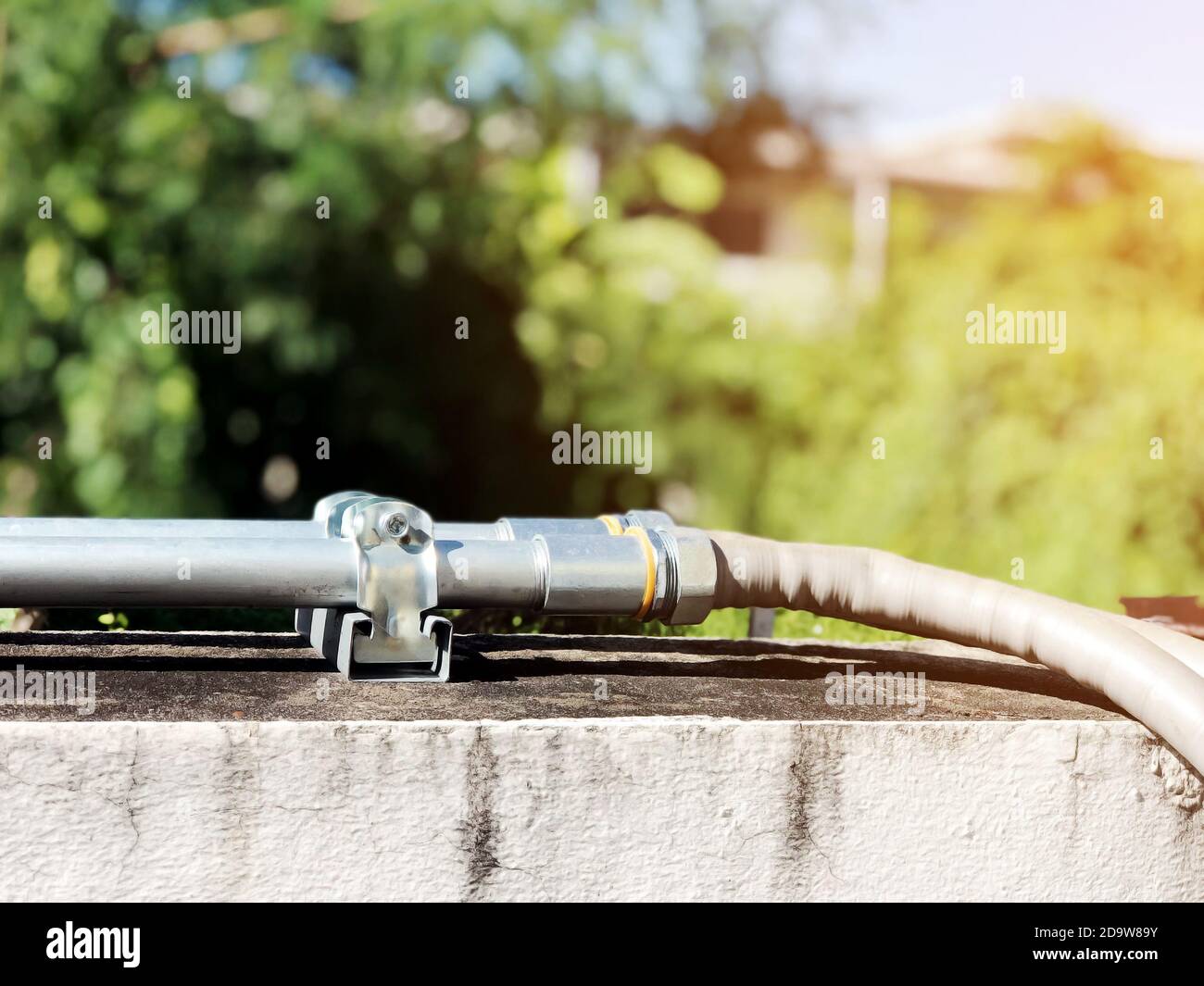 Closeup the steel pipes for external electrical wires installed on the ...