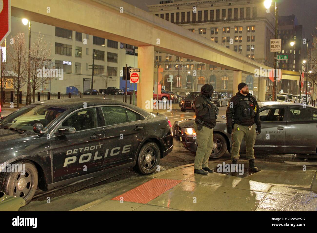 Detroit police officers downtown on a rainy night in Detroit, Michigan ...