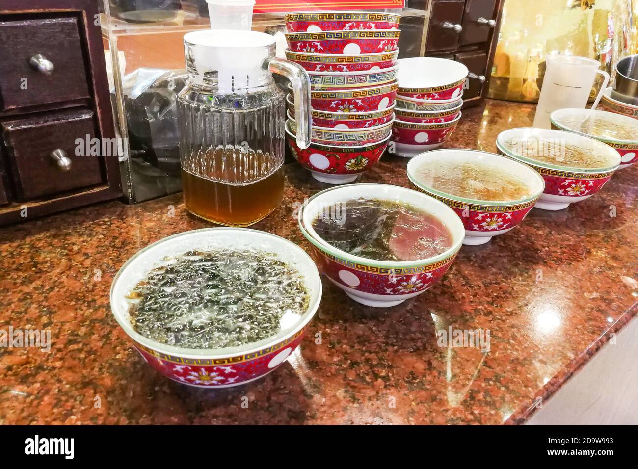 Bowls of Therapeutic traditional Chinese medicine soup tea at retail ...