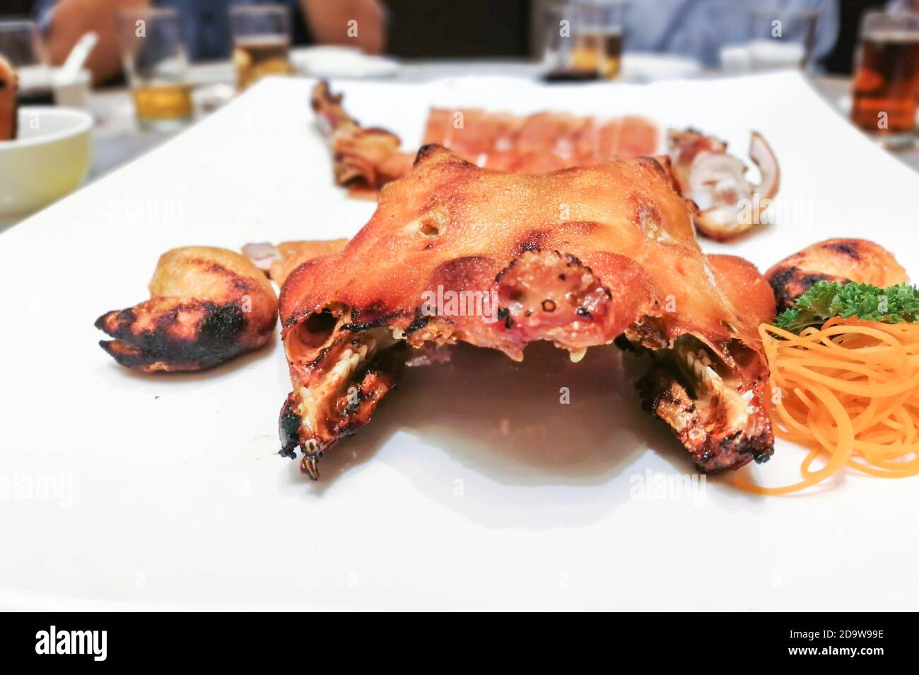 Serving of delicious suckling pig in restaurant during celebration ...