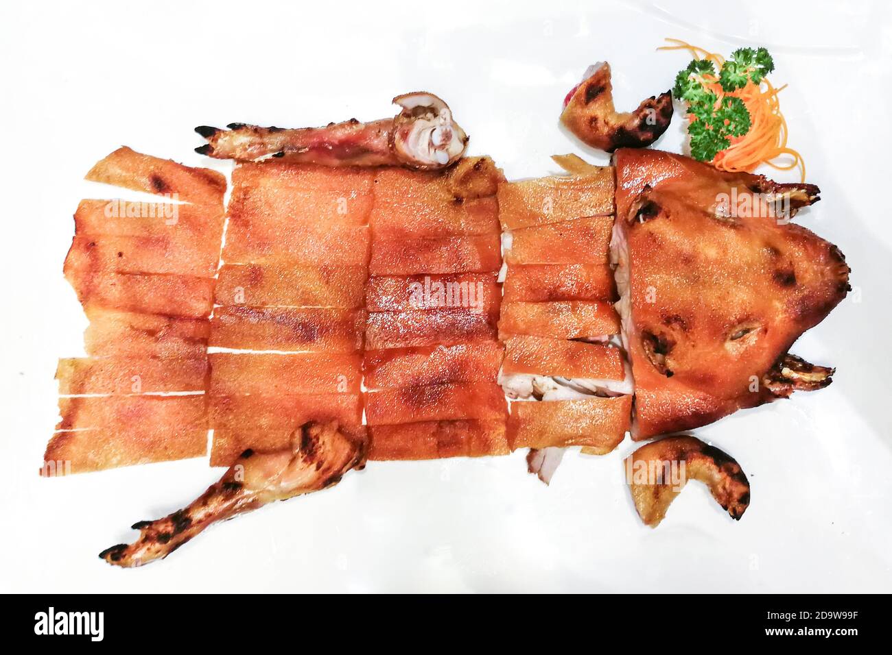 Serving of delicious suckling pig in restaurant during celebration ...
