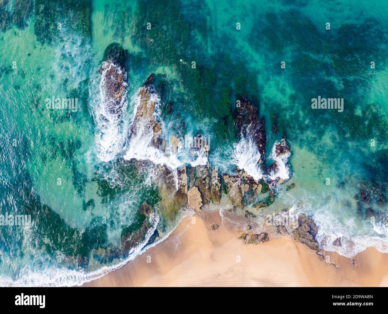 Top down view of rocks and waves at Dudley Beach in Newcastle Australia ...