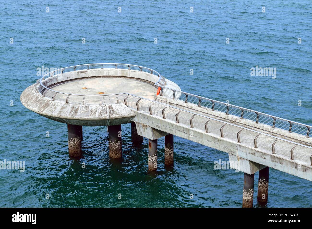 Concrete bridge pier extending into the sea Stock Photo - Alamy