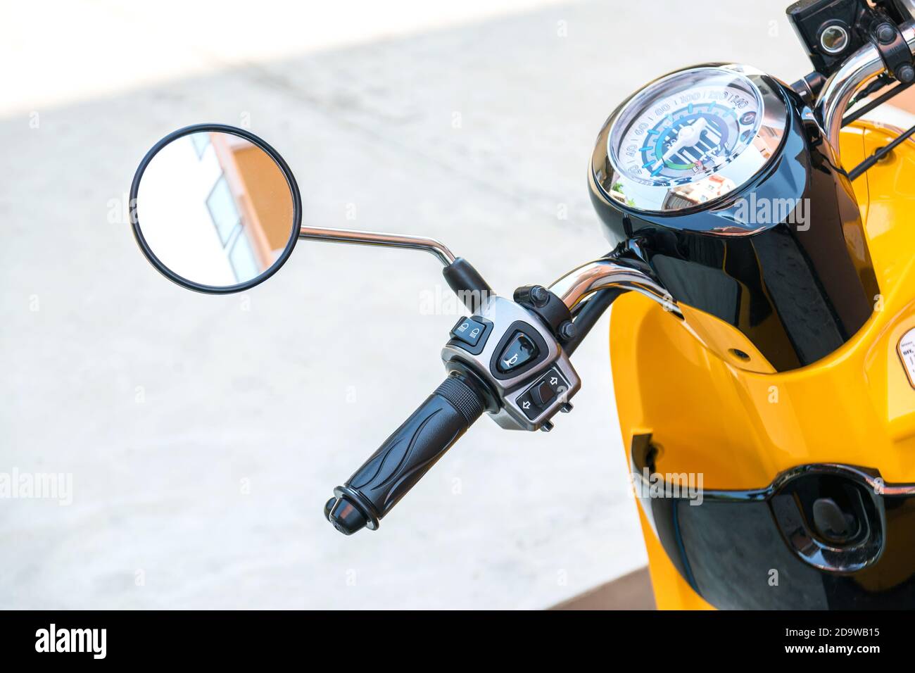 Closeup to handle,speedometer and rear view mirror of the motorcycle ...