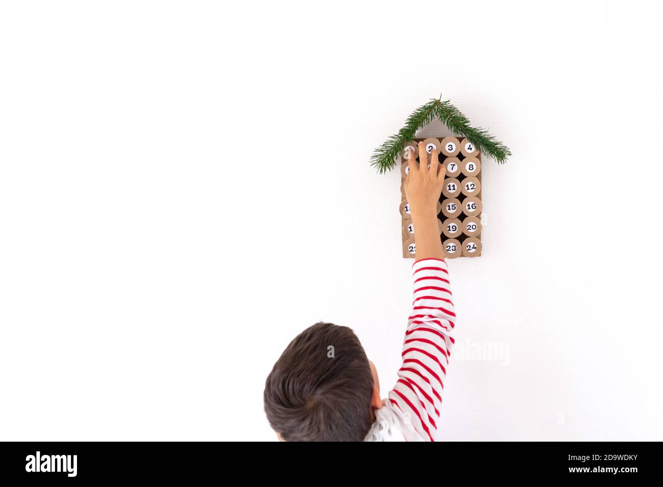 boy opening advent calendar, christmas gift for kids, DIY, step 5 Stock ...
