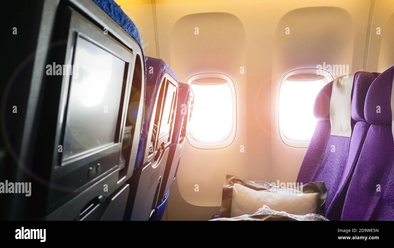 The light of the sun peeking into the window of the plane Stock Photo ...