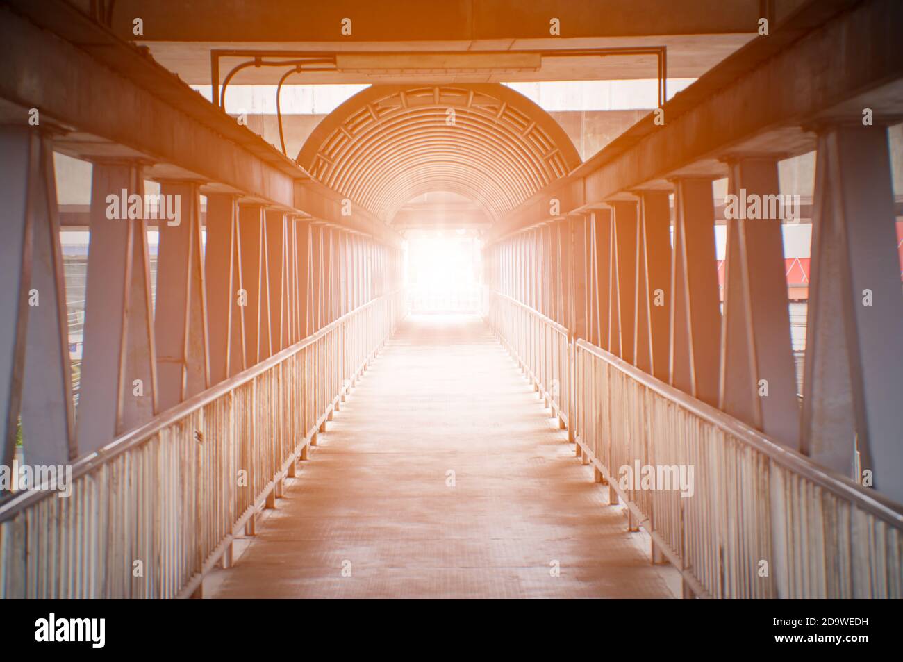 Orange light on pedestrian overpass concept for light discovery Stock ...
