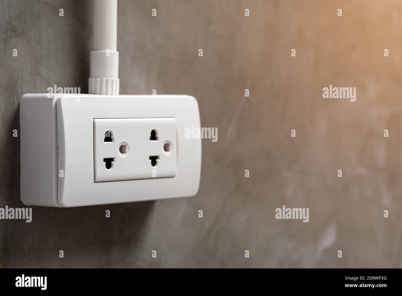 Closeup the electrical plug socket on concrete wall Stock Photo - Alamy