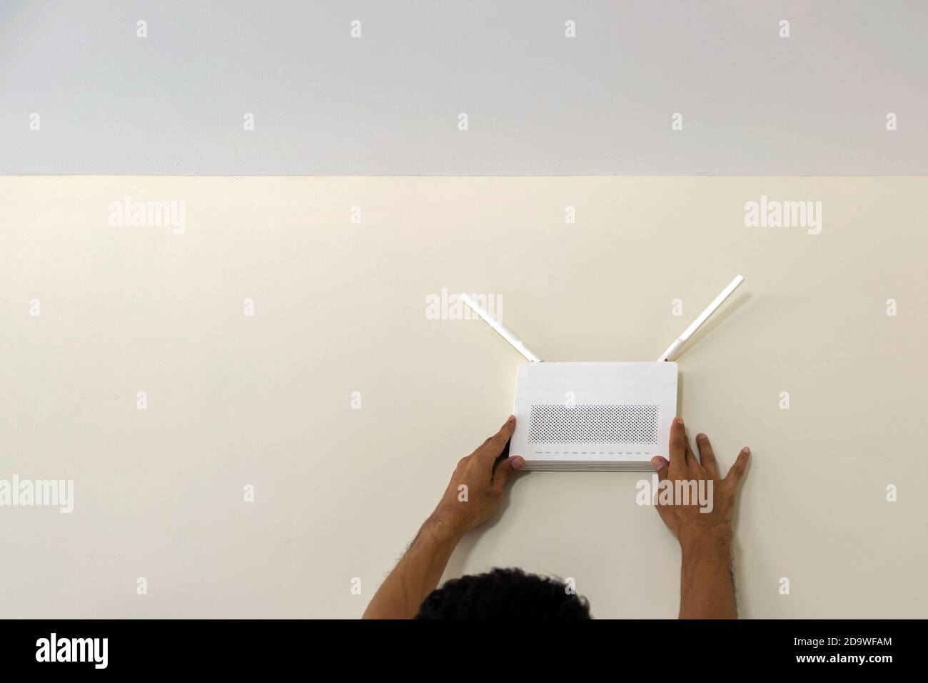 The technicians are installing a wireless internet access point ...