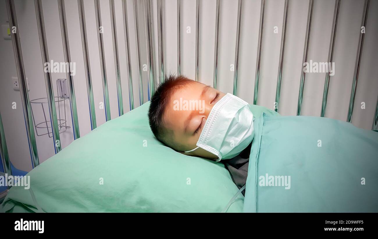 The boy is wearing a nasal discharge, is sleeping, and gives saline ...