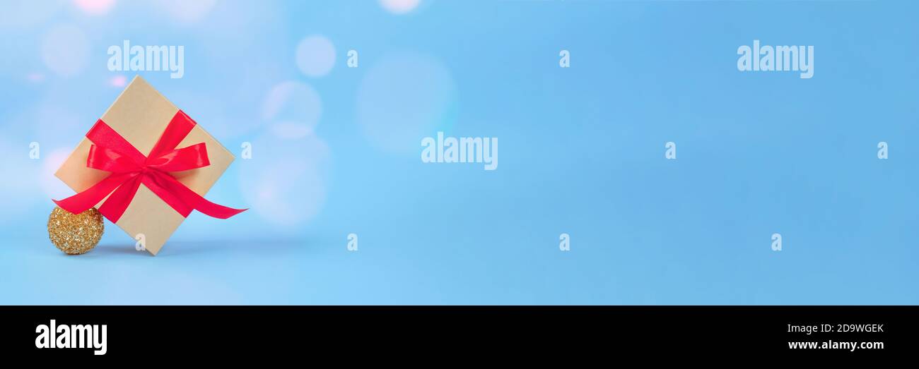 Banner with present box with red bow and Christmas tree decorations on ...