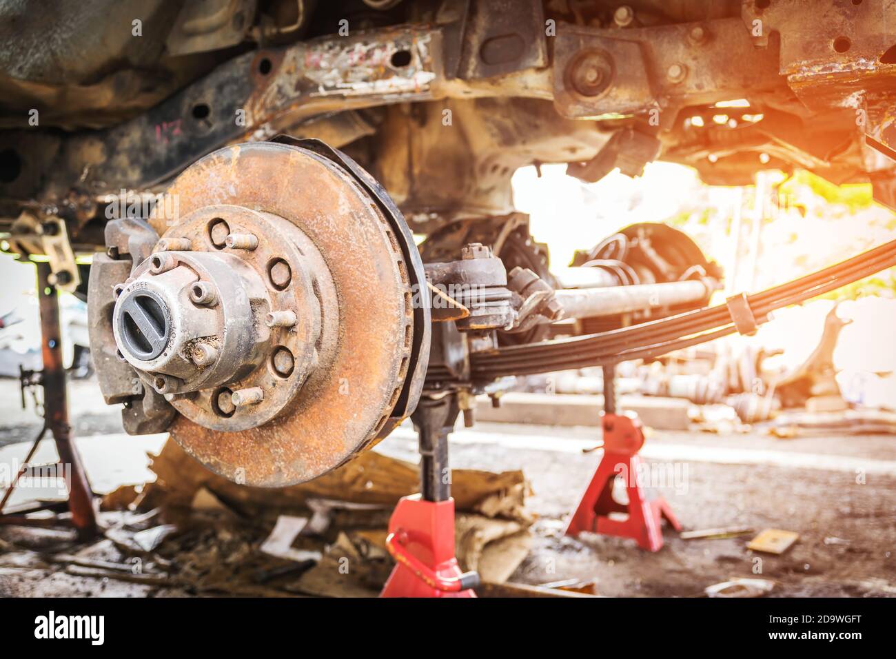 Old and rusty car's suspension, which removes the wheels for repair ...