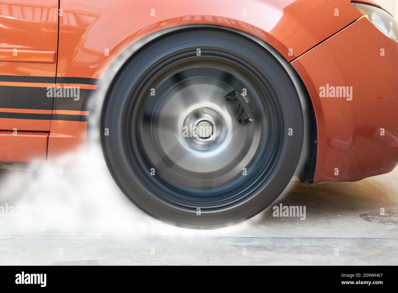 Showing burning tires racing car in racetrack Stock Photo - Alamy