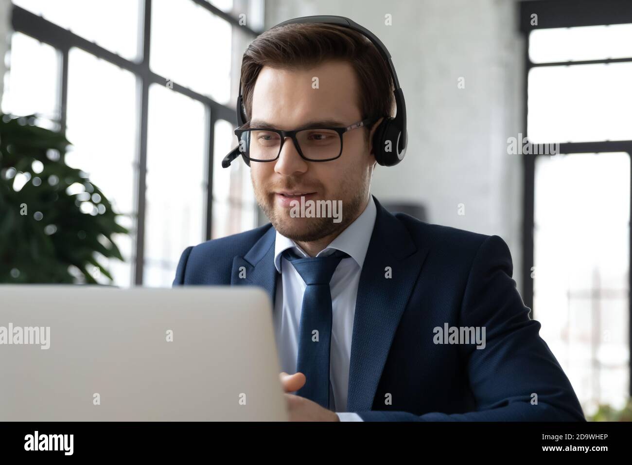 Happy 30s ceo executive manager holding video call Stock Photo - Alamy