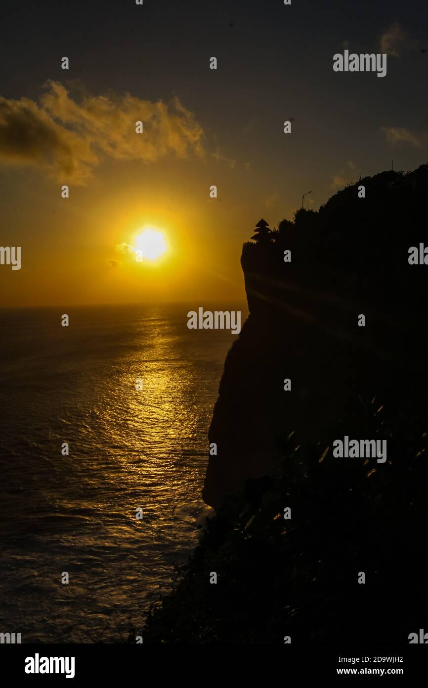 Sunset at Uluwatu Temple at Uluwatu Beach, Bali Stock Photo - Alamy