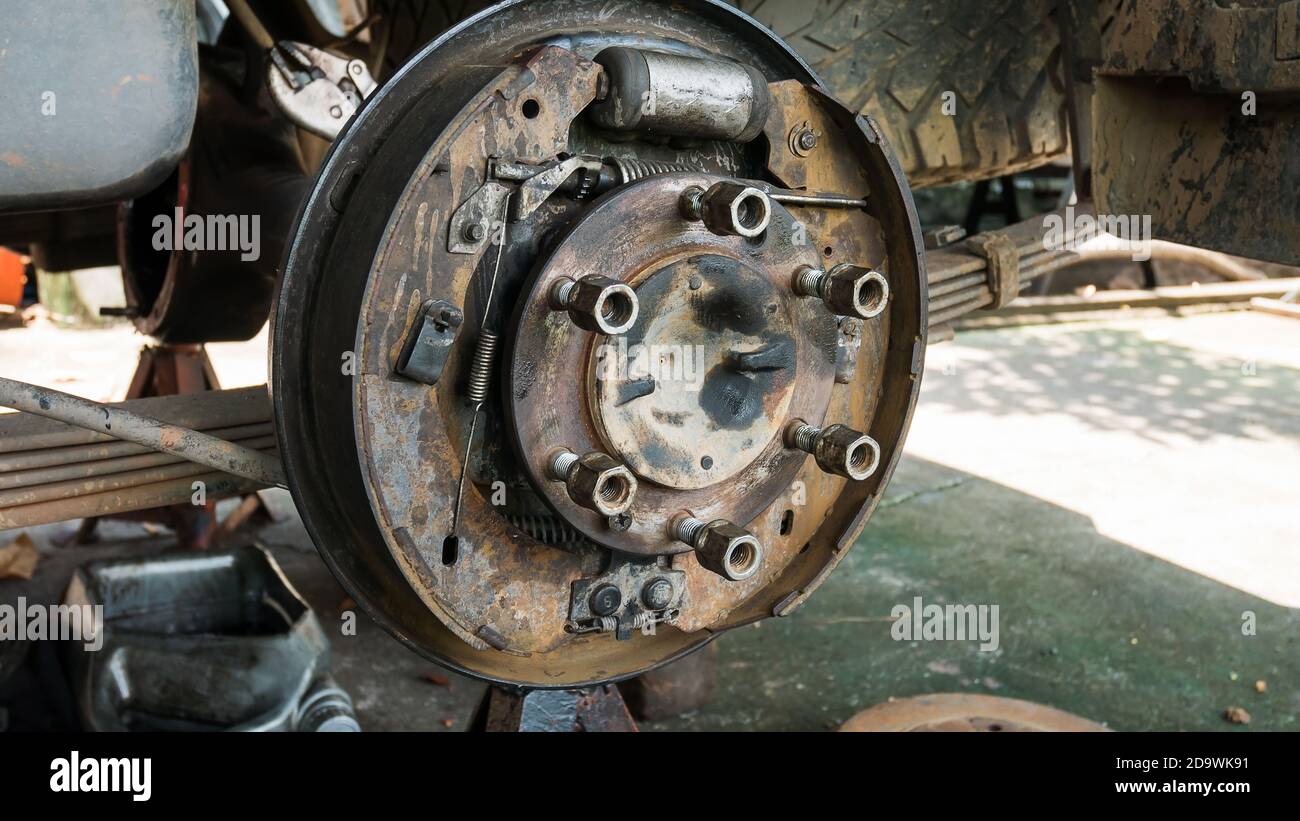 Old and rusty car's suspension, which removes the wheels for repair ...