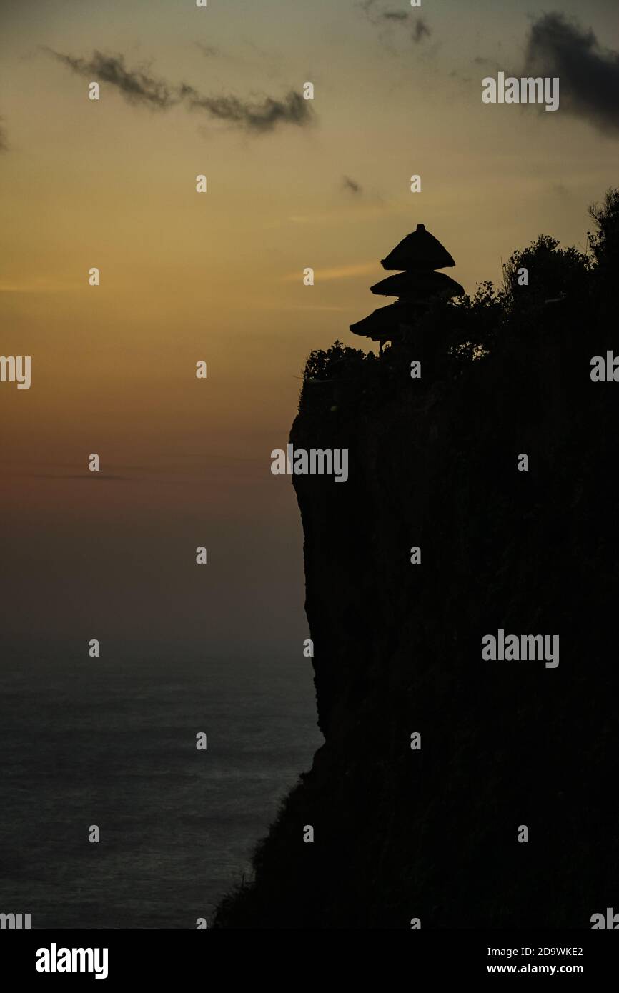 Sunset at Uluwatu Temple at Uluwatu Beach, Bali Stock Photo - Alamy