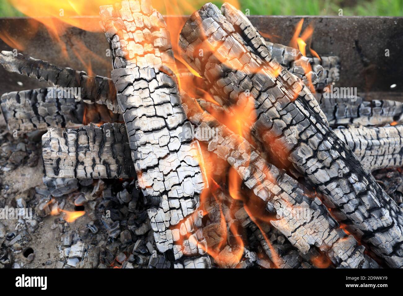 Details of fire wood burning in brazier Stock Photo - Alamy