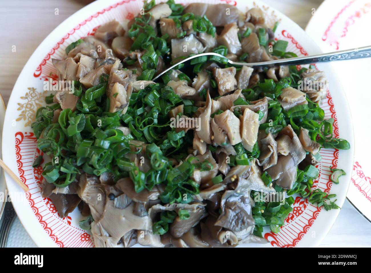 Pickled Mushrooms with Chives on a plate Stock Photo - Alamy