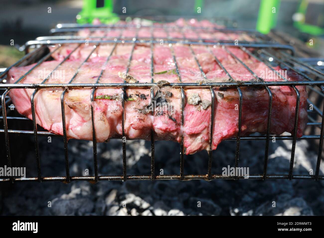 Cooking BBQ Pork Neck on a picnic Stock Photo - Alamy