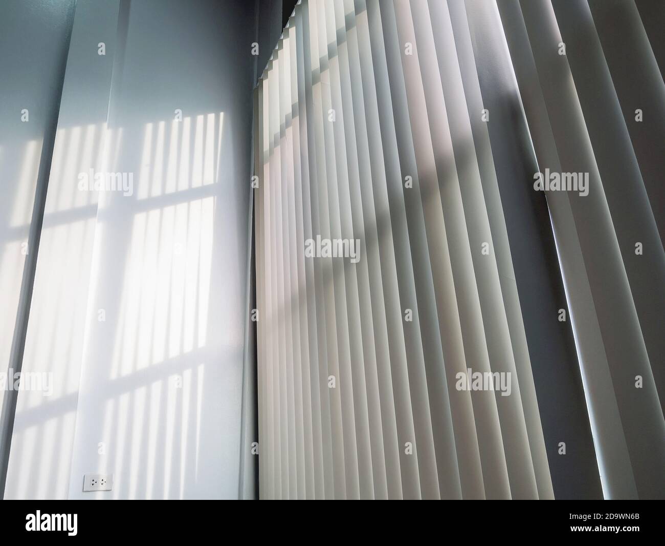 Beams of light passing through the channel of the sun visor inside the ...