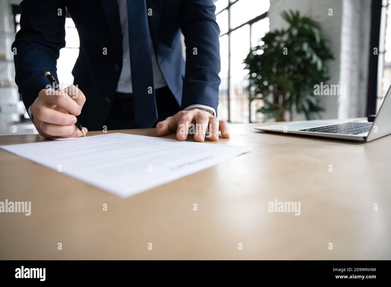 Close up young male ceo executive manager signing documents Stock Photo ...