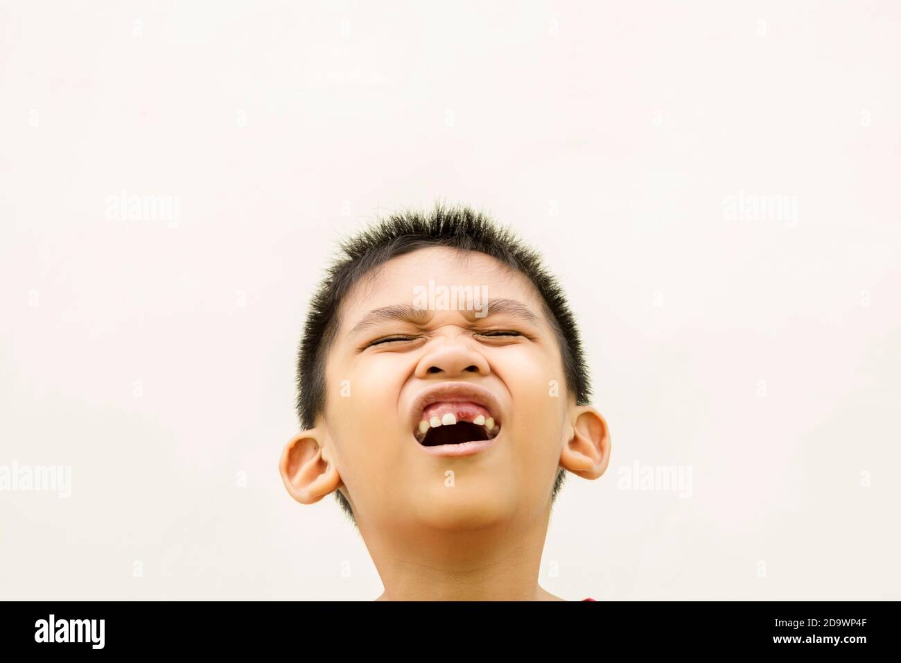 Close up in front of a boy singing in pain because of toothache Stock ...