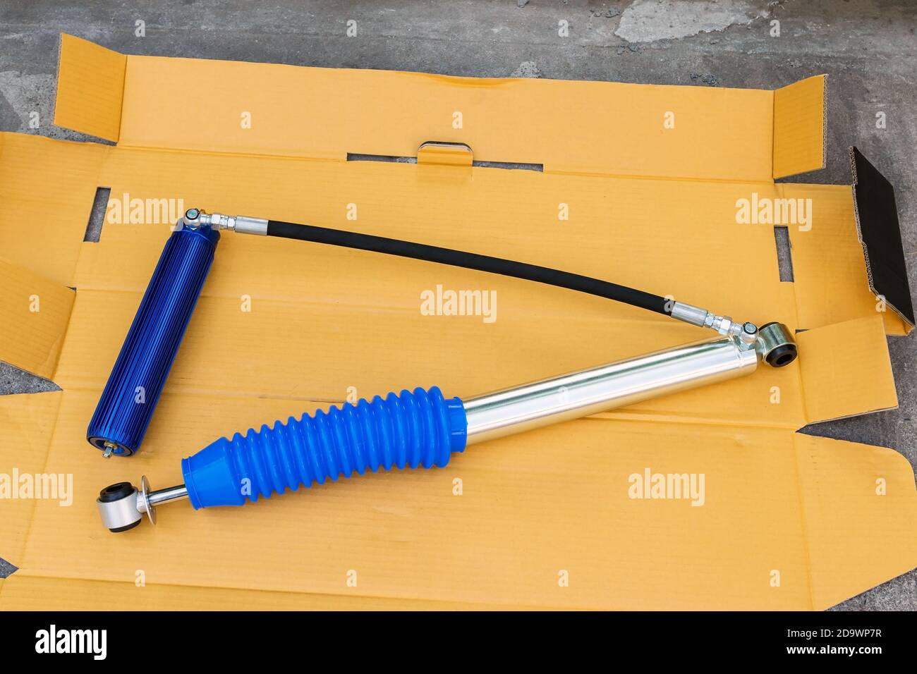 New shock absorber for the car was laid out on a paper box Stock Photo ...