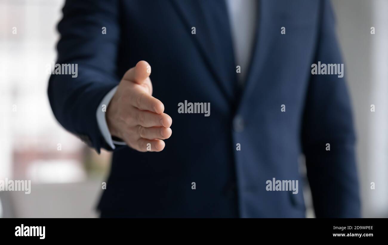 Hand reaching out suit hi-res stock photography and images - Alamy
