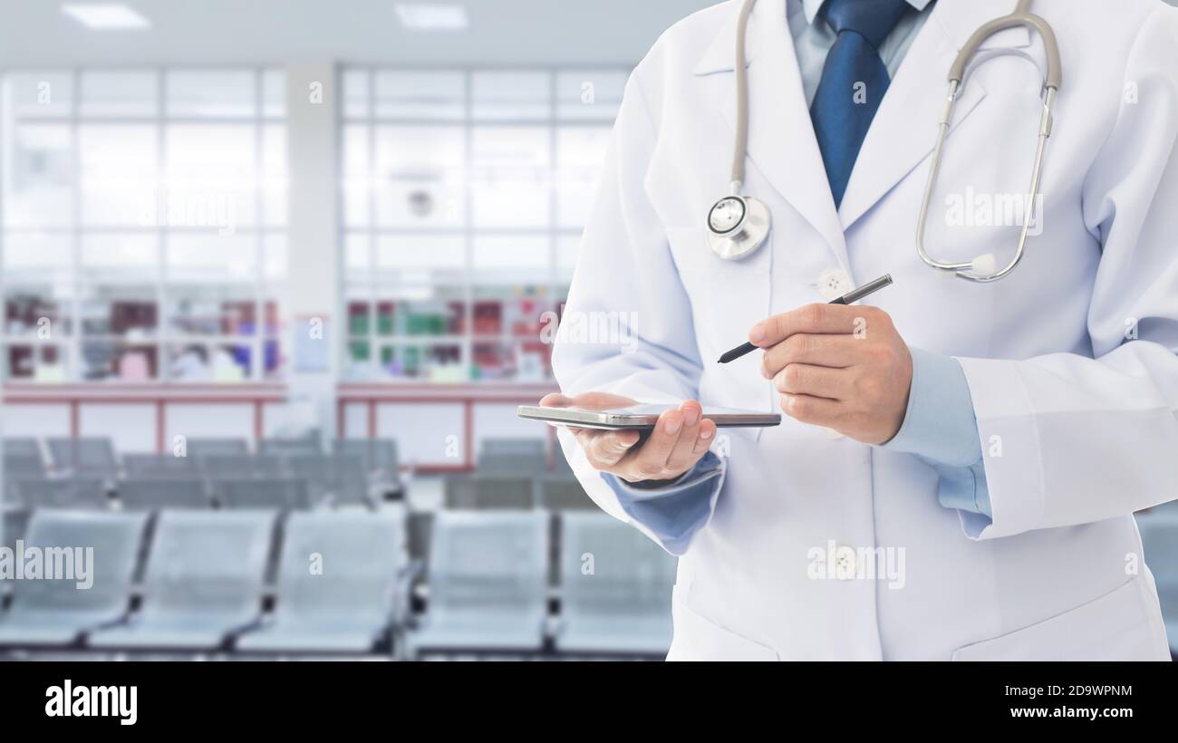 Doctor using a mobile phone in hospital. Concepts of healthcare and ...